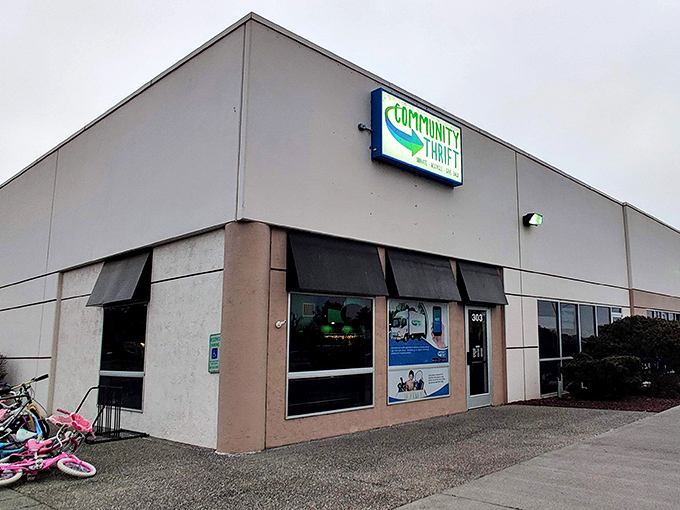 Community Thrift announces itself with a swoosh of green hope. This unassuming building houses countless second chances.