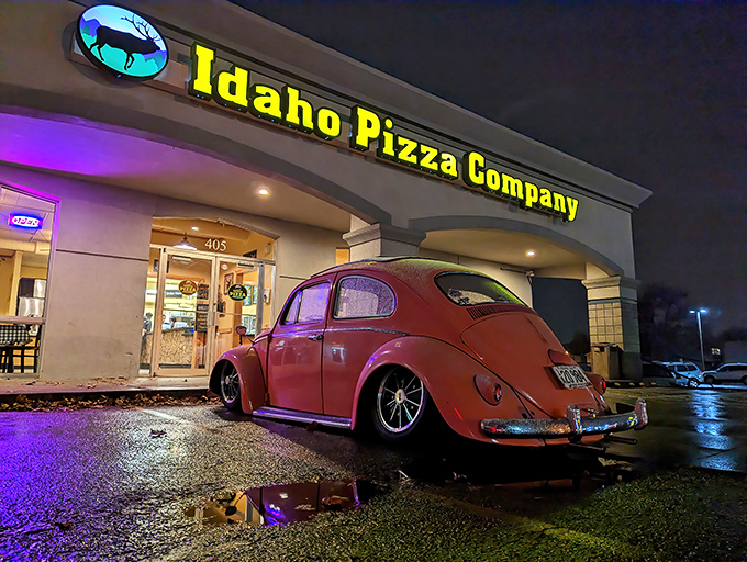 Idaho Pizza Company's glowing sign becomes a beacon of hope when hunger strikes after dark. That vintage Beetle adds extra charm!