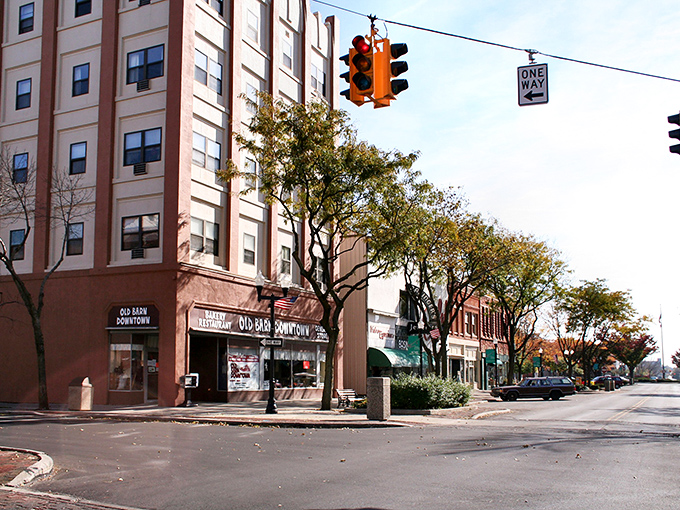 Lima's downtown storefronts create a nostalgic streetscape that feels warmly familiar. The traffic light seems to say "slow down and enjoy the view."