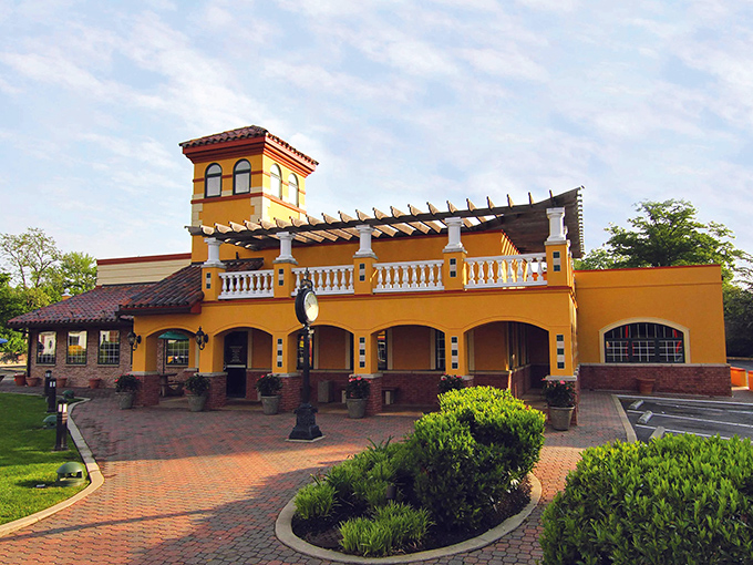 Who ordered Spanish villa with a side of perfect pizza? Pizza John's yellow building stands out like a vacation for your taste buds.