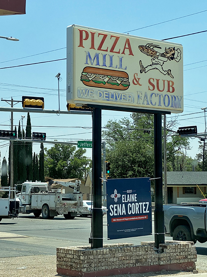 Pizza Mill's vintage sign stands tall against the New Mexico sky. A beacon of hope for the hungry since before Instagram food pics existed.