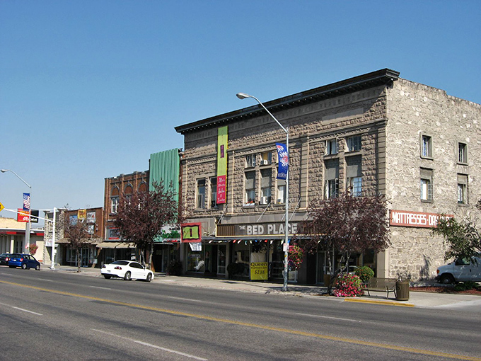 Rexburg's wide main street showcases a blend of historic and modern buildings against a backdrop of Idaho's famous big sky.