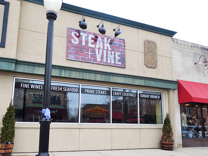 Brick meets modern signage in downtown charm that promises fine dining without the intimidation factor.