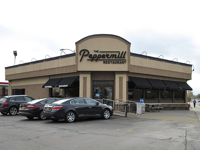 The Peppermill's distinctive curved roof has sheltered generations of happy diners. Rochester's steak sanctuary stands ready.