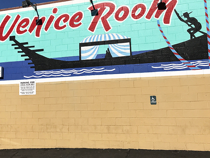 The Venice Room's turquoise wall and vibrant mural signal that this isn't your grandfather's steakhouse - unless your grandfather was really cool.