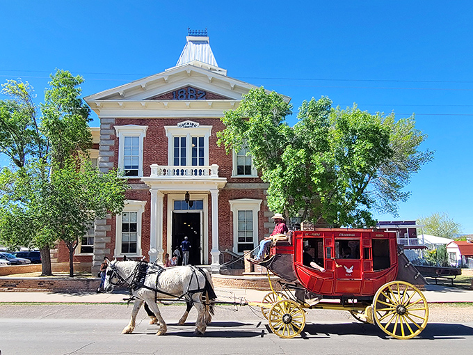 A horse-drawn stagecoach adds living history to the imposing red-brick courthouse where Wild West justice was dispensed in Tombstone.