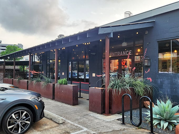 Truth Barbeque's sleek black building with its colorful "Truth" sign &ndash; where honesty in smoking meat is the only policy.