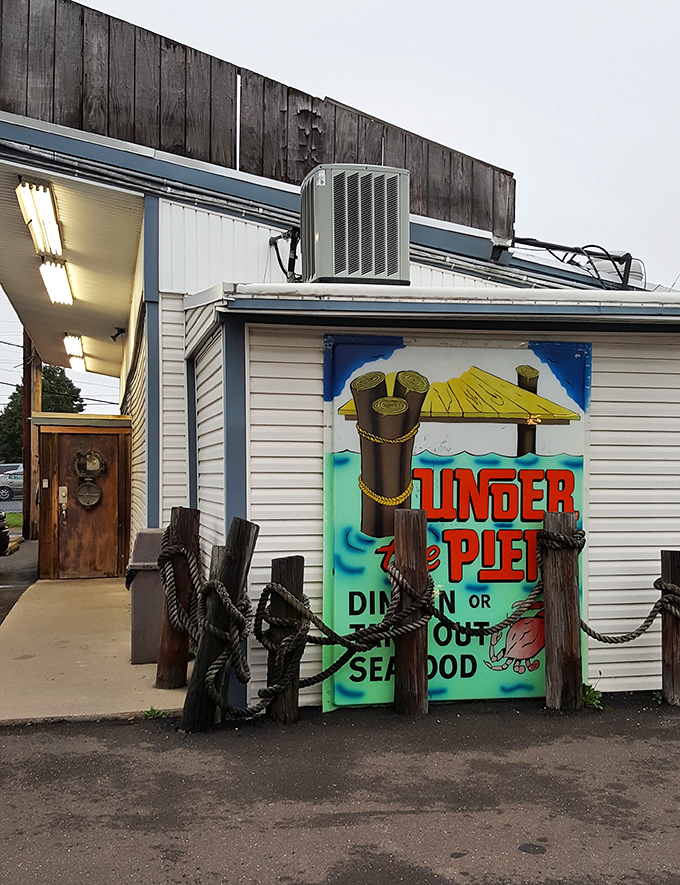Under the Pier's nautical entrance sets the scene for seafood magic. Those wooden posts practically whisper tales of legendary fish fries.