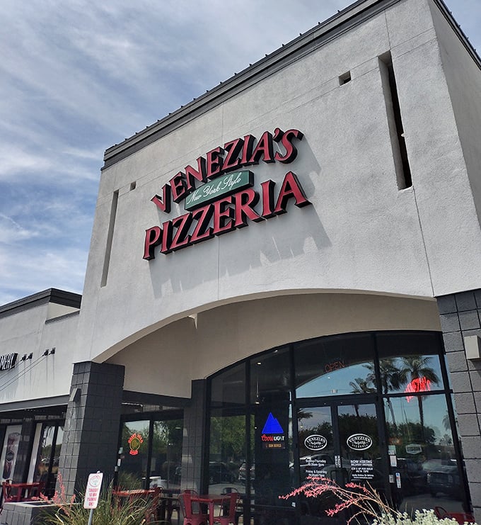 Venezia's clean white storefront is like a blank canvas&mdash;the real masterpiece is the New York-style pizza waiting inside. No subway ride required!