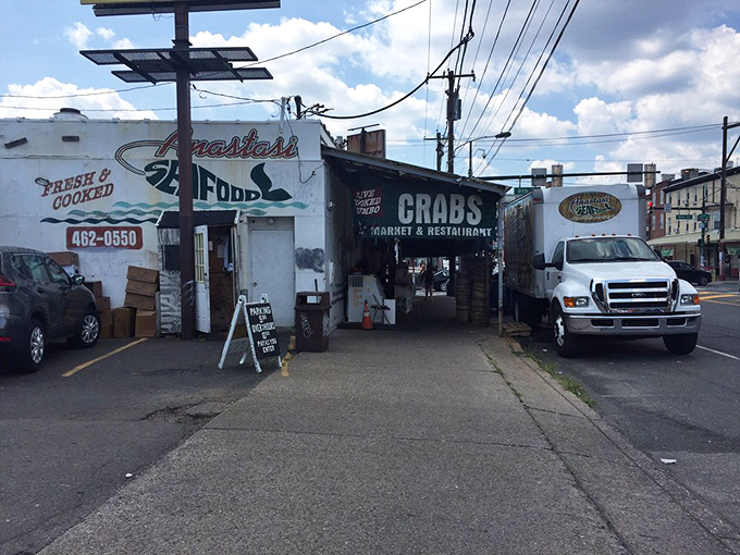 The unassuming entrance to Anastasi's hides a dual-purpose paradise: pick your fish, then eat it too!
