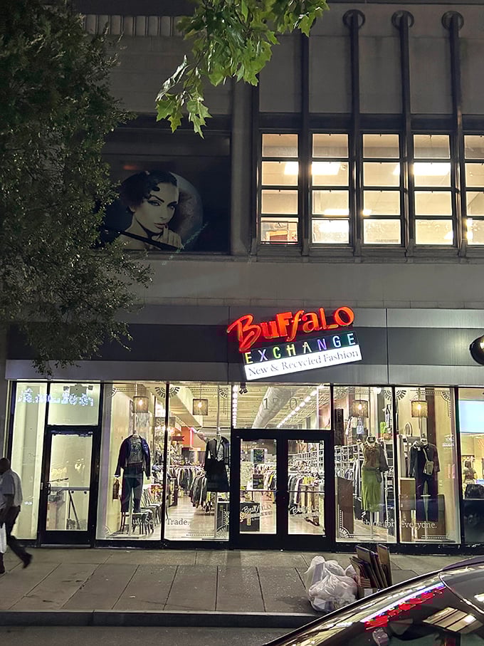 "Night shopping adds mystery to the hunt. Buffalo Exchange's illuminated windows showcase curated fashion treasures."