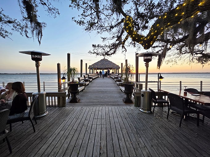 Nature's dining room awaits at sunset. Cap's oak-draped deck delivers the kind of ambiance money usually can't buy.