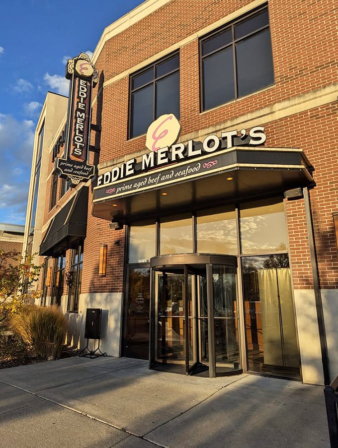 The vertical Eddie Merlot's sign stands tall, much like the reputation of their perfectly aged steaks.