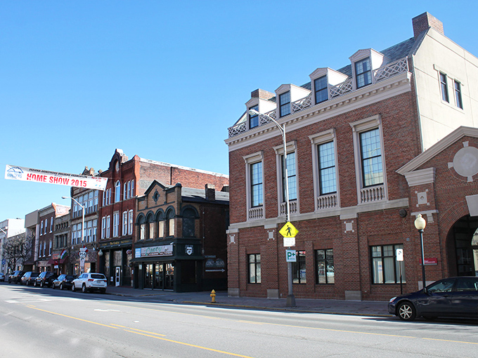 Historic brick buildings line Indiana's main street, offering affordable spaces to live and shop near quality medical facilities. 