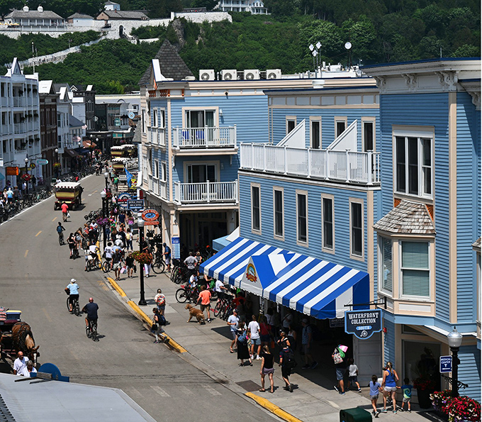 The bustling Main Street of Mackinac Island offers a rare glimpse of life where horses still have the right of way over horsepower.