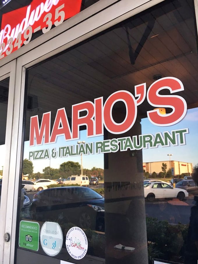 Classic Italian-American pride shines through Mario's bold storefront. That red and green sign is like a beacon for pizza lovers.