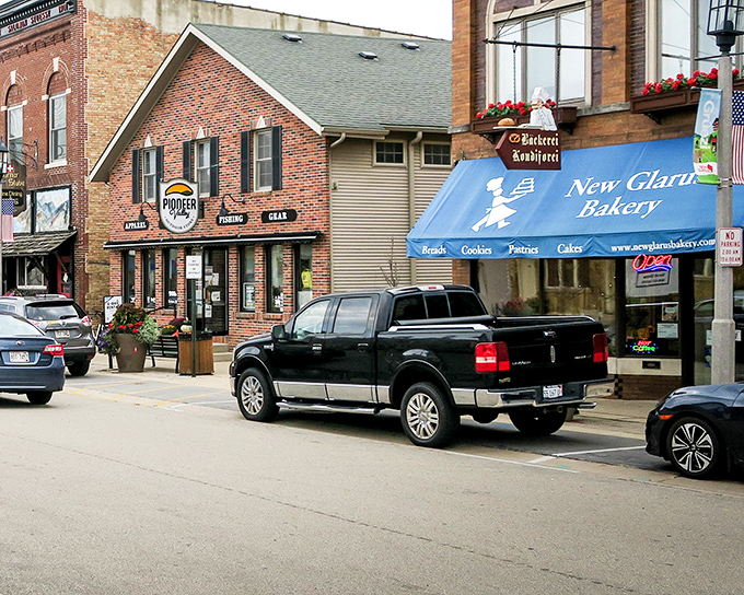 Downtown New Glarus showcases its Swiss-inspired storefronts. That's not a movie set—it's real Wisconsin with Alpine charm!