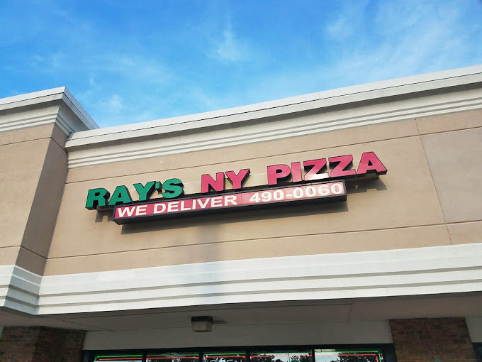 That straightforward sign promises exactly what New York pizza should be: no gimmicks, no frills, just folding-required deliciousness.