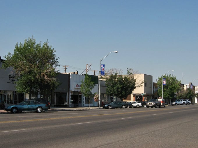 A statue stands sentinel in downtown Rexburg, where clean streets and well-maintained buildings reflect community pride.