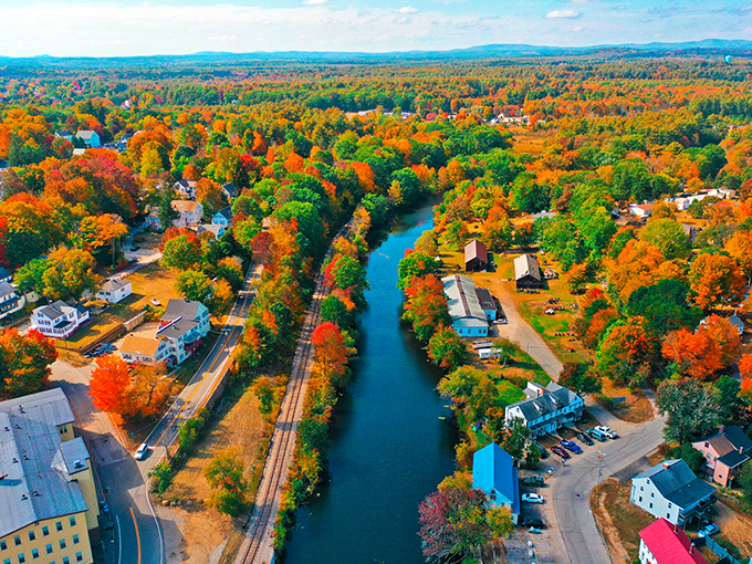 Somersworth's autumn colors transform an ordinary river view into nature's most spectacular light show.