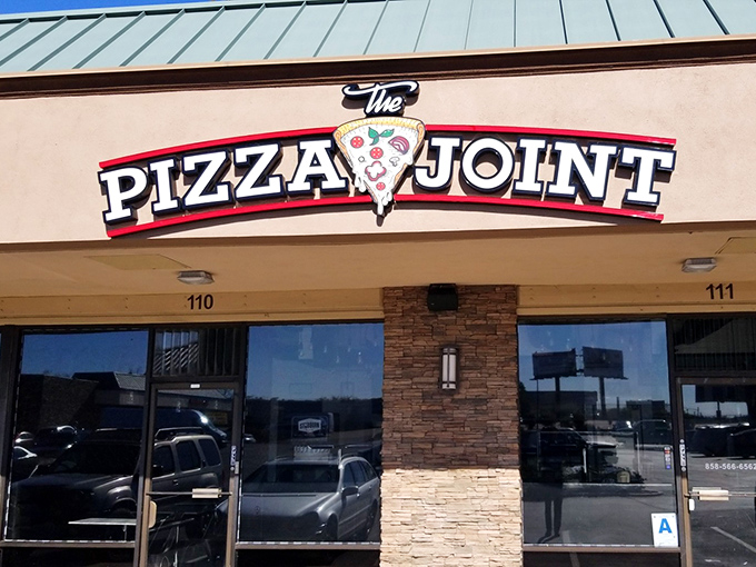 The Pizza Joint's stone facade hints at the solid pizza fundamentals waiting inside. No-nonsense deliciousness ahead!