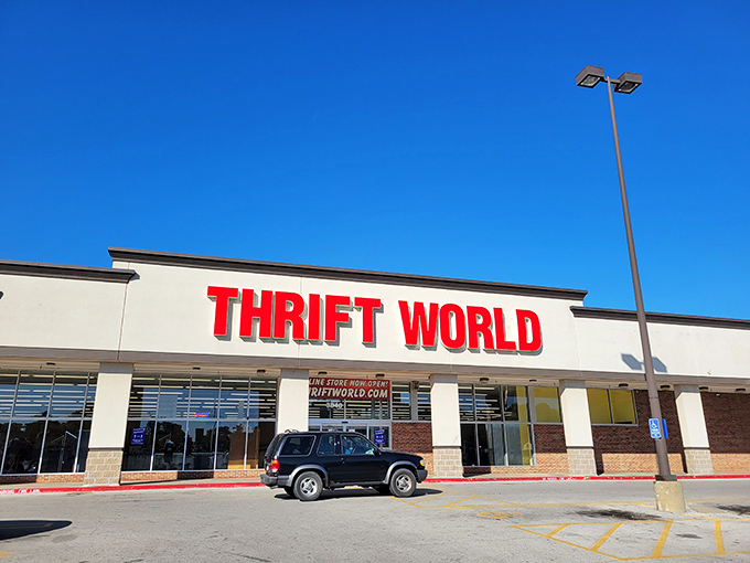 Morning sunshine makes Thrift World's bold red letters pop against the sky. A lone vehicle suggests you might beat the crowds!