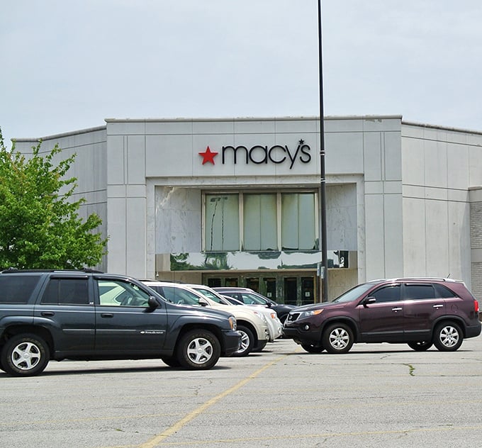Spring blossoms frame Tippecanoe Mall's Macy's entrance, where shoppers find refuge from Indiana's unpredictable weather patterns.