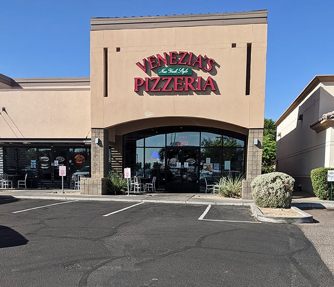 Don't let the simple exterior fool you&mdash;inside this unassuming building lurks pizza that would make a Manhattan cabbie feel right at home.