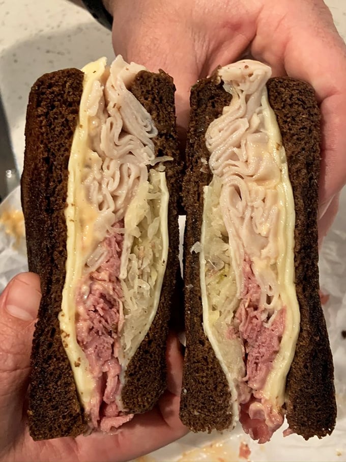 This black and white Reuben showcases the artistry of contrast&mdash;dark rye, pink meat, pale sauerkraut. It's sandwich architecture at its finest. 