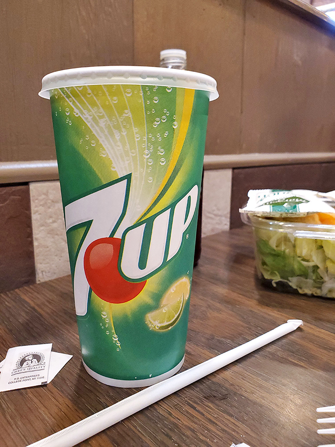 Even the 7UP feels special here, standing by like a faithful companion ready to wash down that perfect bite of seafood.