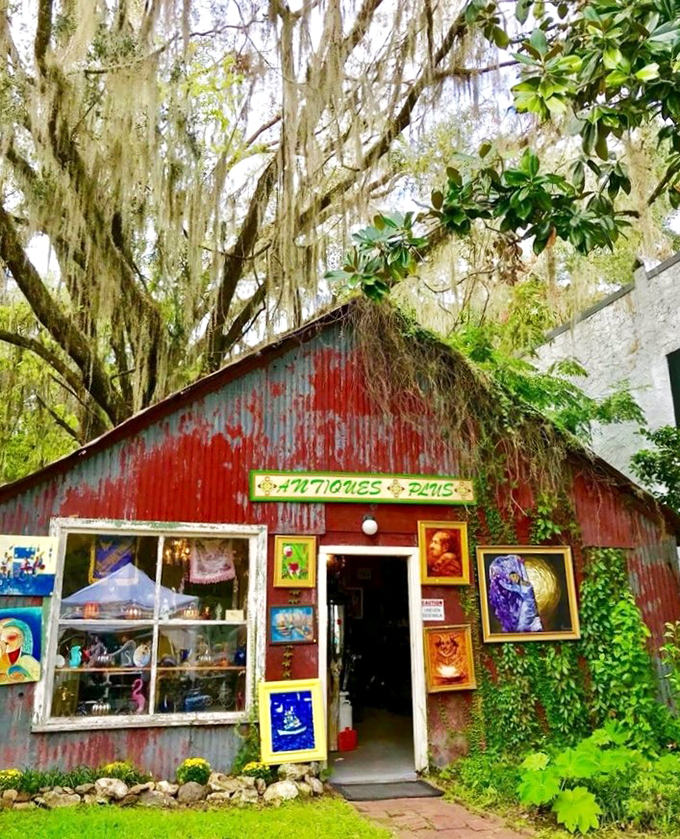 This rustic red antique shop proves that sometimes the most authentic treasures come in buildings that look like they might not survive the next hurricane.