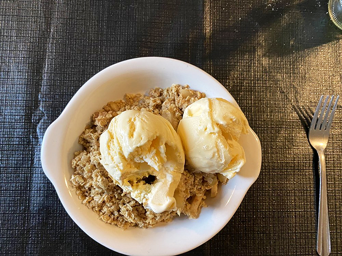 Apple crisp crowned with vanilla ice cream&mdash;the dessert equivalent of a warm hug from your favorite grandparent after a satisfying meal.