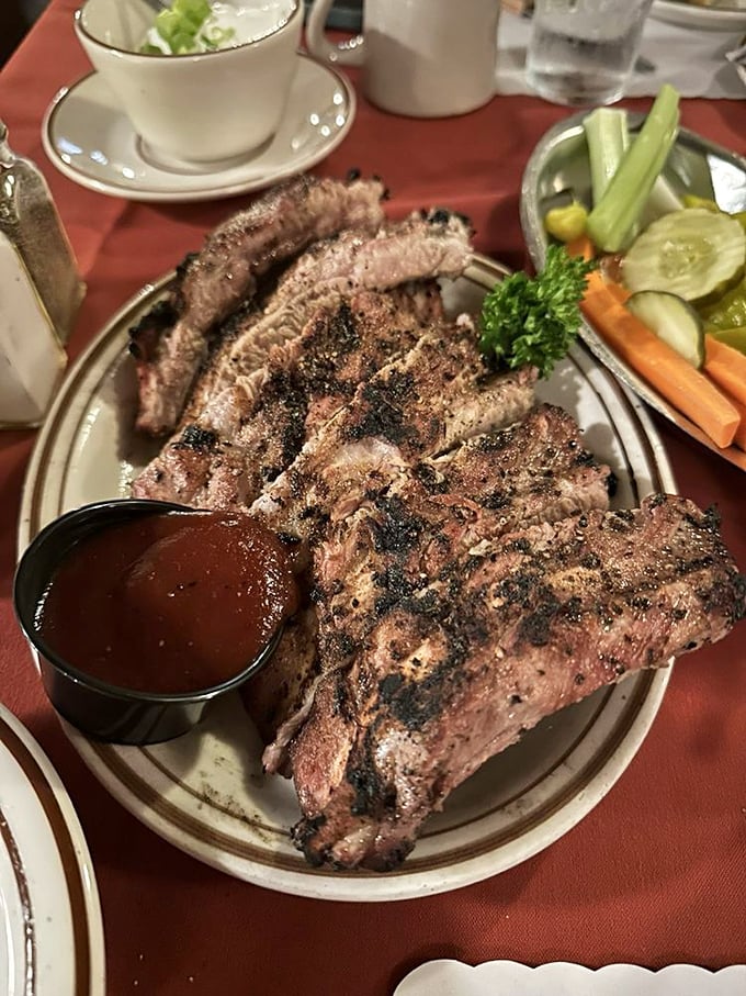Baby back ribs with that signature oak-grilled flavor and a side of house sauce&mdash;finger-licking goodness that laughs at dignity.