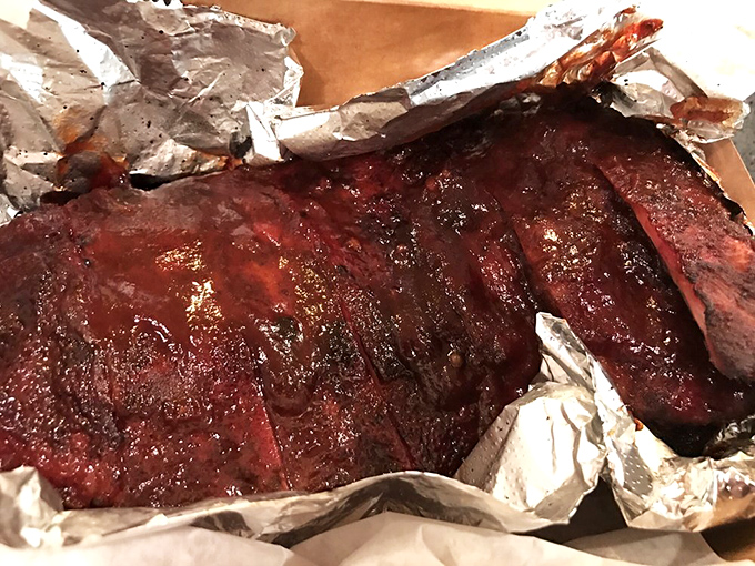 These ribs aren't just falling off the bone &ndash; they're practically volunteering to jump onto your fork with their glistening, smoky perfection.