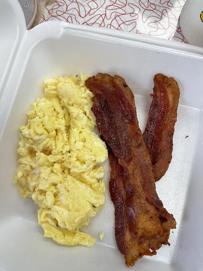 Scrambled eggs so fluffy they practically hover above the plate, with bacon that's achieved that magical balance between crisp and chewy.