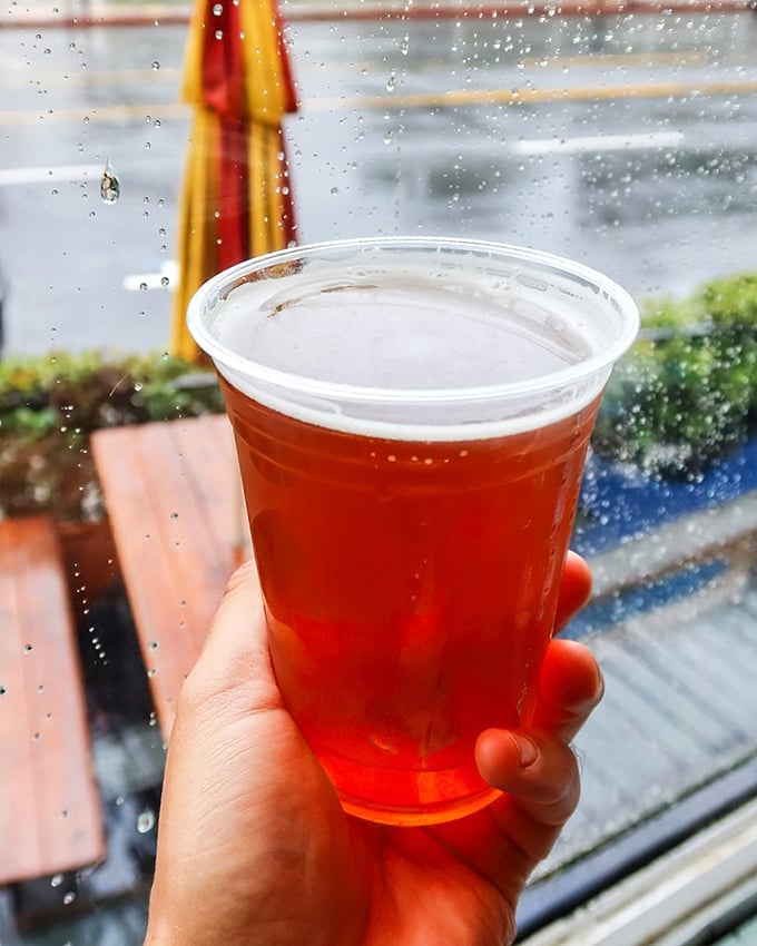 Even on a rainy day, that amber brew in a plastic cup somehow tastes better when enjoyed with a view of the iconic yellow train.