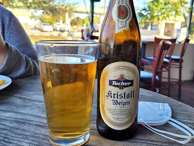 Tucher Kristall Weizen isn't just beer &ndash; it's liquid German heritage in a glass, sunshine-colored and perfect for washing down everything on the menu.