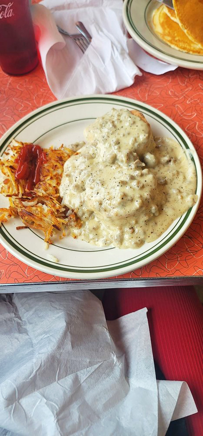 Biscuits and gravy: the breakfast that hugs you from the inside. This plate doesn't just say "good morning"&mdash;it belts out "HELLO, SUNSHINE!" with creamy, peppery enthusiasm.