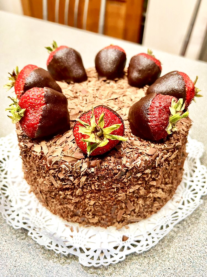 Chocolate-dipped strawberries standing guard around a chocolate fortress. This cake isn't just dessert&mdash;it's an edible work of art worth every calorie.