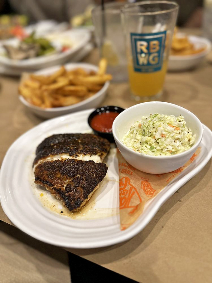 Blackened grouper that's had a perfect spa day in seasoning. Florida's favorite fish showing off why it earned the title.