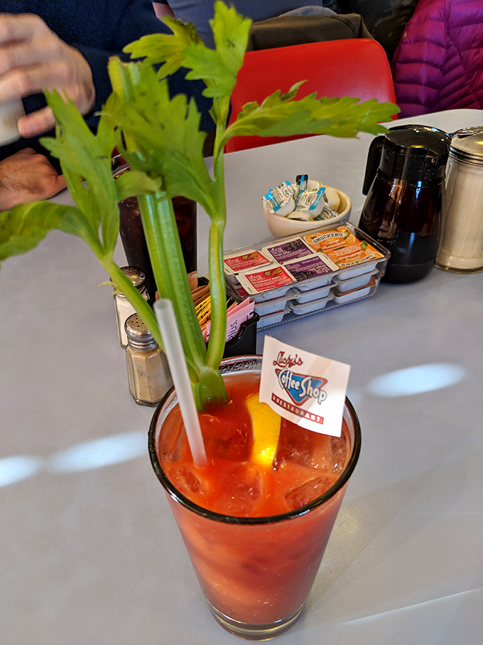 A Bloody Mary garnished with celery stalks tall enough to qualify as a vegetable serving. Breakfast of champions, indeed.