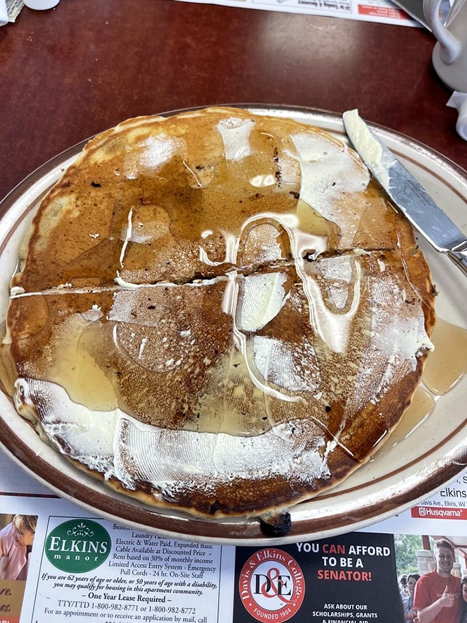 Pancake perfection swimming in buttery, syrupy bliss. This breakfast masterpiece is why elastic waistbands were invented.