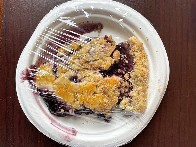 Blueberry crumb pie that captures summer in every bite. Those purple juice stains aren't mess&mdash;they're badges of honor for serious pie enthusiasts.
