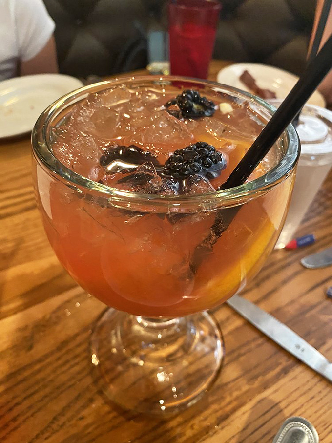 This isn't just any cocktail&mdash;it's a Bourbon Punch that makes waiting for a table feel like part of the experience rather than a delay.