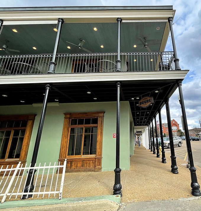 Bour&eacute;'s balcony practically begs you to sip something strong and watch the square's daily theater unfold below.
