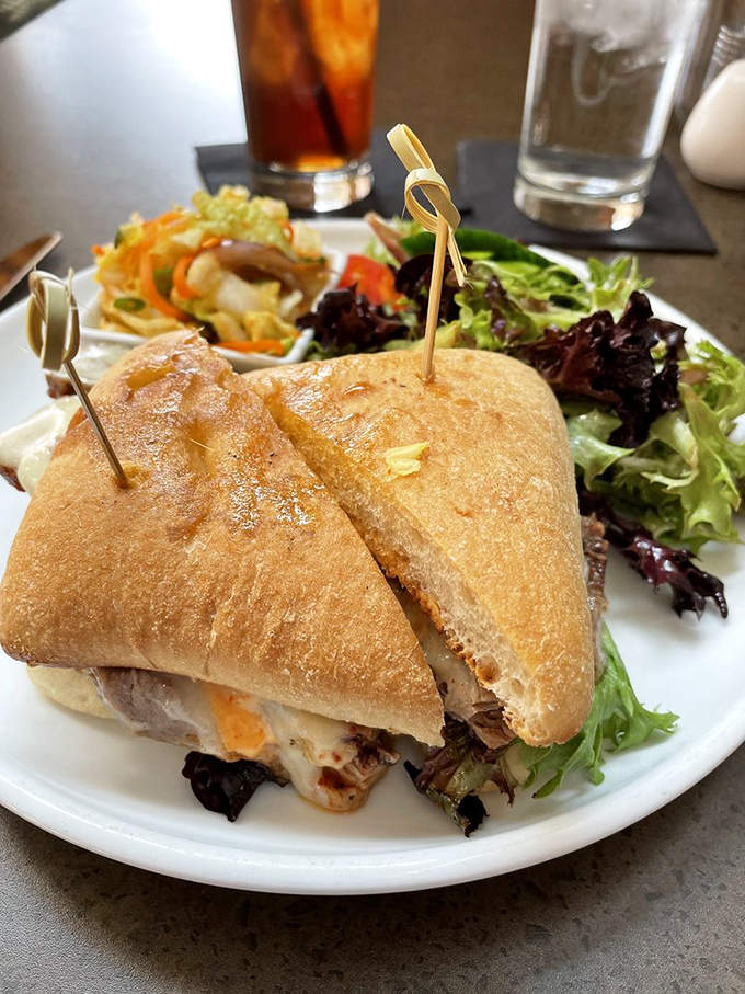 A sandwich that requires both hands and your full attention. The side salad is just pretending to be healthy &ndash; we all know why you're really here.