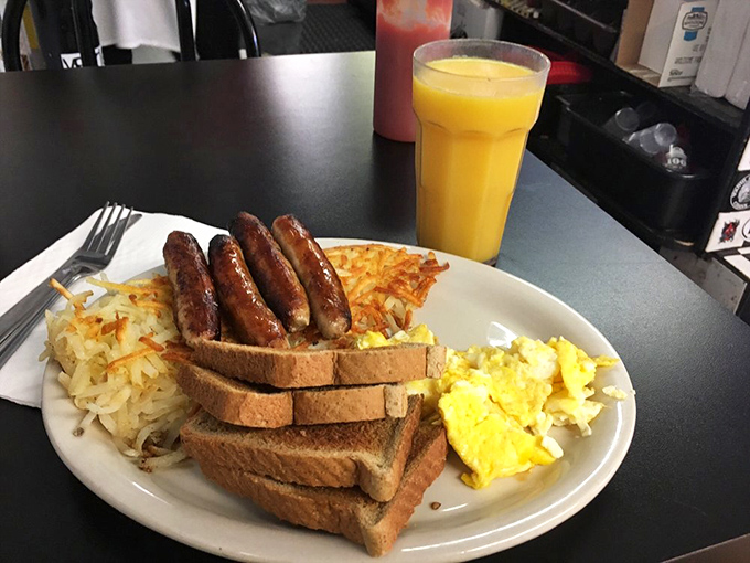 Breakfast of champions&mdash;or night owls. Those sausages stand proud next to perfectly scrambled eggs, while hash browns crisp up for the occasion.
