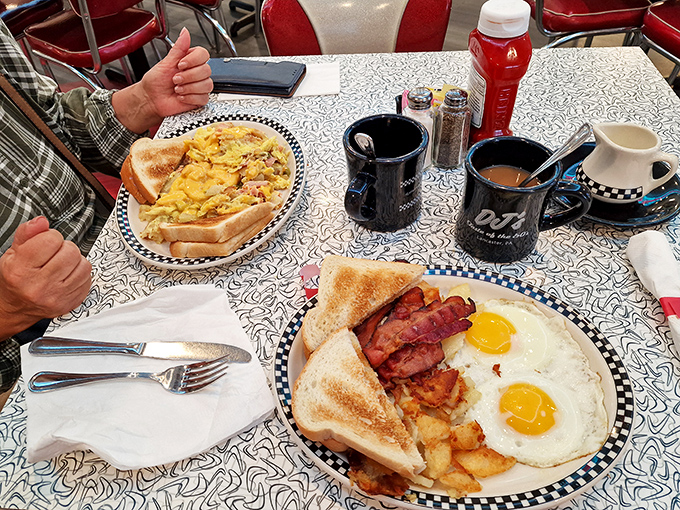 The breakfast of champions! Sunny-side-up eggs, crispy bacon, and golden hash browns&mdash;the holy trinity of morning perfection served on classic diner plates.
