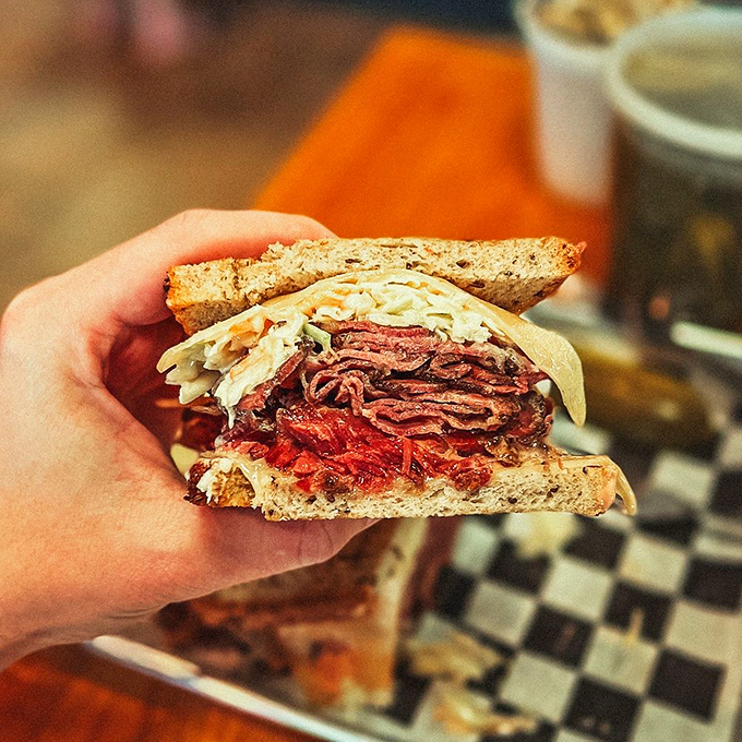 Not just a sandwich, but a complete production. The coleslaw and potato salad aren't sides&mdash;they're essential characters in this delicious story.