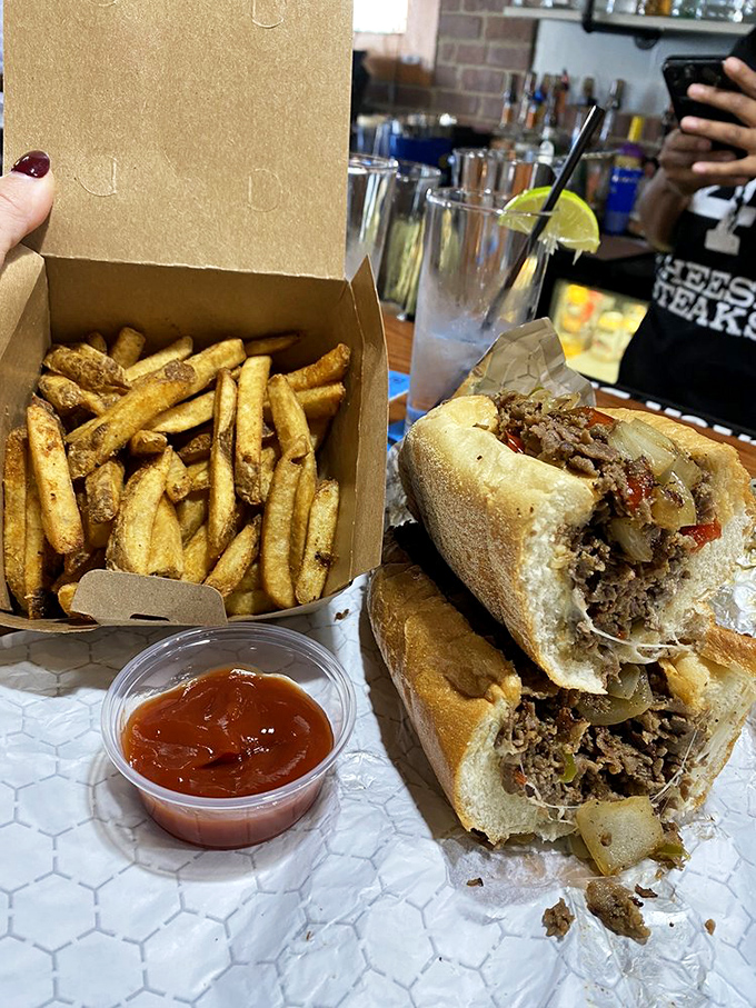 The perfect pairing: a properly stuffed cheesesteak alongside fries that deserve their own fan club. This is why elastic waistbands were invented.
